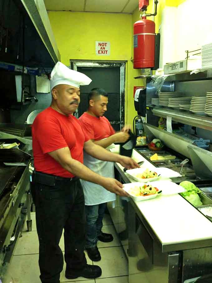 Behind the scenes, culinary choreography happens in a kitchen where experienced hands turn simple ingredients into breakfast magic.