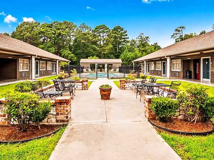 Affordable living extends to visitor accommodations, where this well-maintained courtyard offers a peaceful respite between Louisiana adventures.