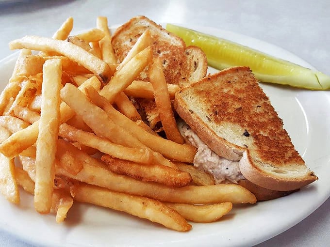 The humble tuna melt &ndash; a sandwich that proves simplicity still matters in a world of overcomplicated food. Those golden fries aren't just a side, they're co-stars.