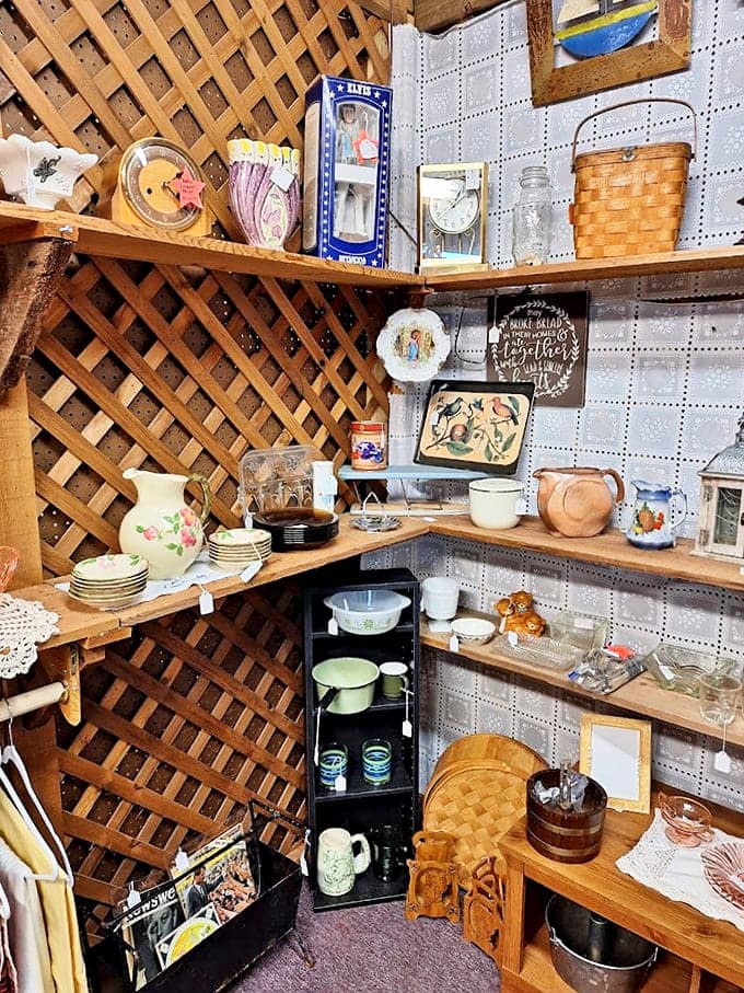 Corner booth perfection with lattice and collectibles. Those vintage Pyrex pieces have survived more family dinners than most marriages.