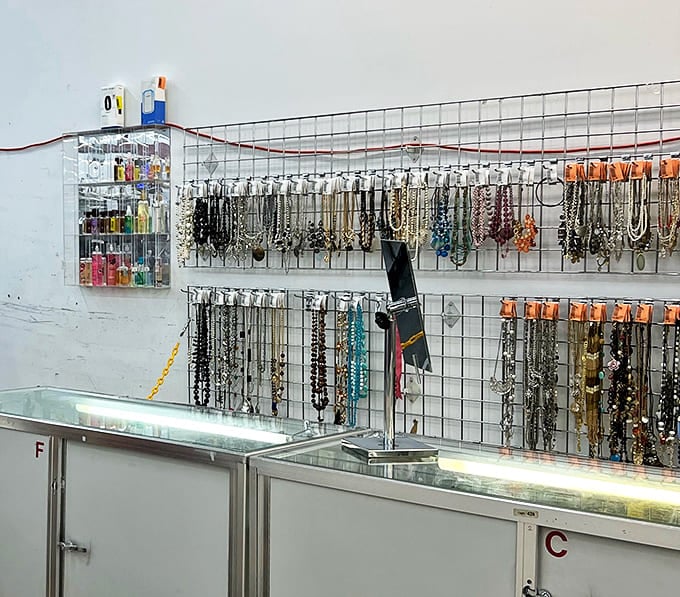 The jewelry display transforms costume pieces into treasure-chest findings. One person's discarded necklace becomes another's conversation starter.