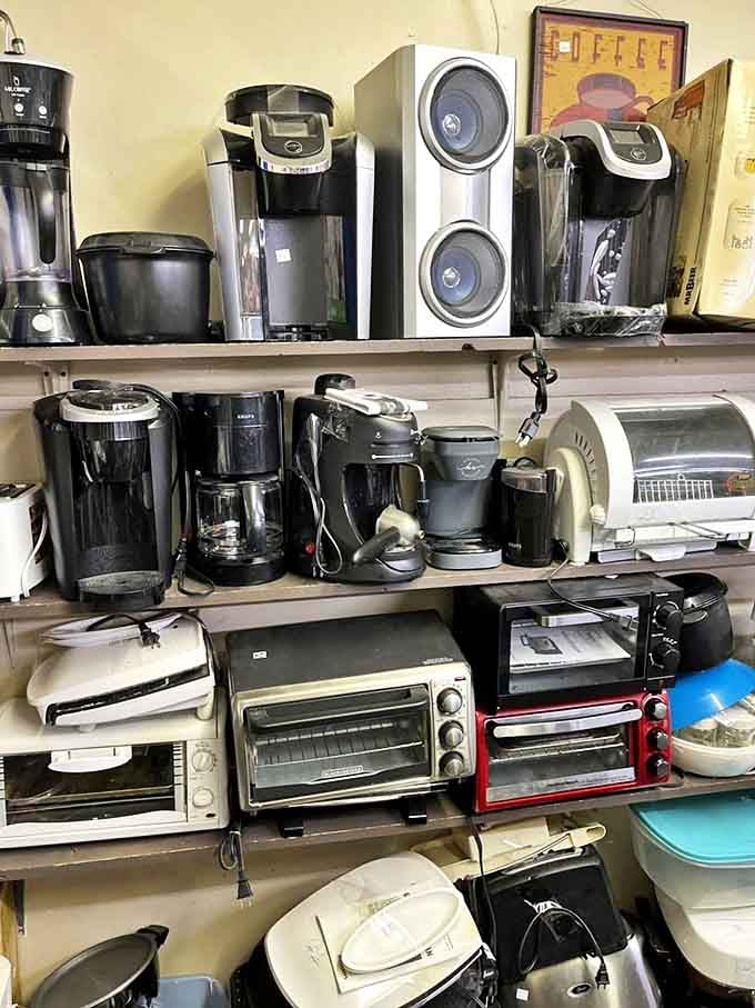 The small appliance graveyard where Keurigs and toaster ovens await resurrection&mdash;proof that one person's kitchen purge is another's morning coffee solution.