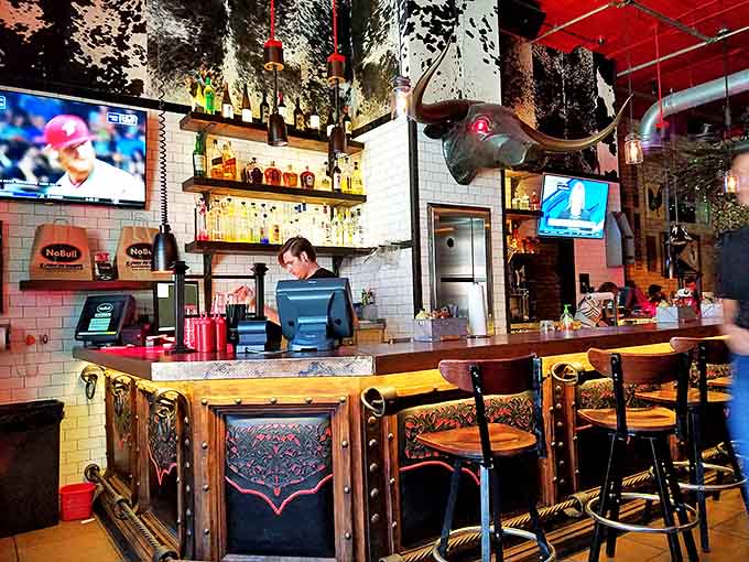 The bar area showcases NoBull's attention to detail—from the cowhide-inspired upholstery to the longhorn accents. Rustic meets refined.