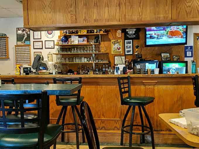 The bar area offers that perfect perch for solo diners or those looking to catch the game while enjoying Henry's legendary offerings.