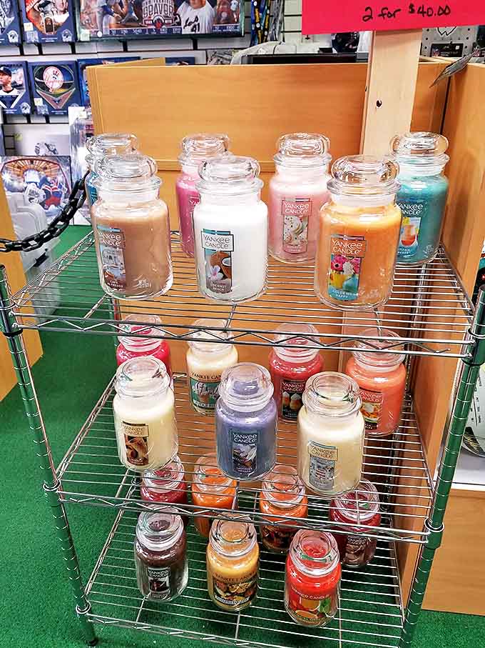 Yankee Candles stacked like a fragrance library &ndash; because nothing says "adulting" quite like getting excited about scents named after baked goods.
