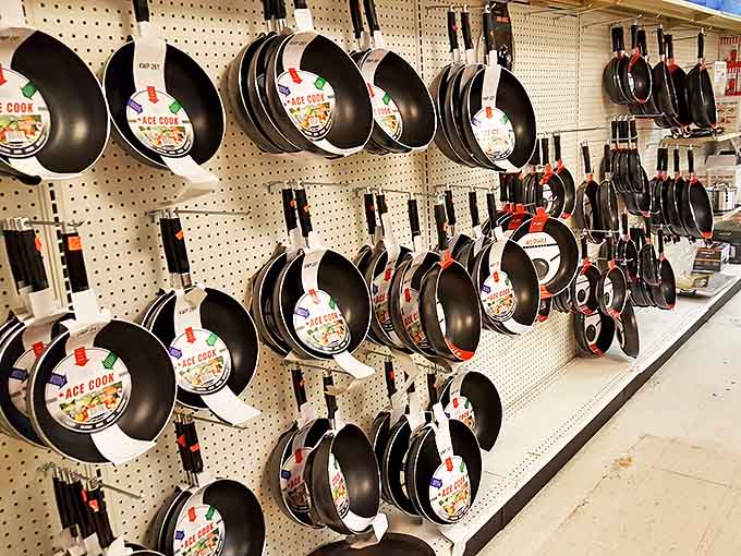 A pegboard symphony of non-stick cookware dangles enticingly, promising culinary adventures without the Williams-Sonoma price tag.