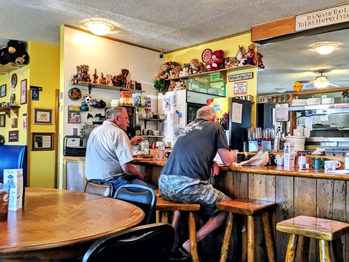 The counter seats offer front-row views to breakfast theater, where regulars exchange stories while awaiting their morning feast.