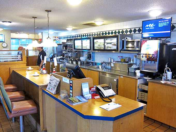 The counter—where solo diners find community, coffee cups are never empty, and the staff remembers how you like your eggs without asking.