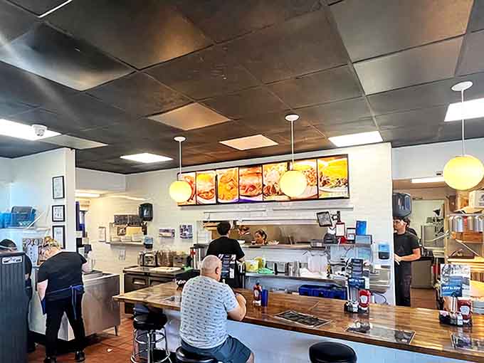 Counter seating: where solo diners become part of the diner family and breakfast becomes dinner theater with a front-row seat.