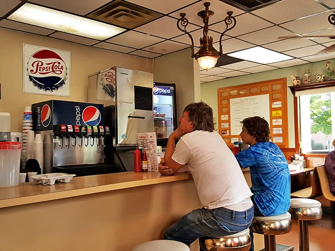 The soda fountain and counter area serve as Thomasville's unofficial town square, where coffee refills and local gossip flow with equal generosity.
