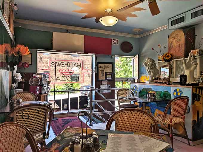 The view from inside reveals Matthew's charm &ndash; vintage decor, Italian touches, and windows that frame Eastern Avenue like a living postcard.