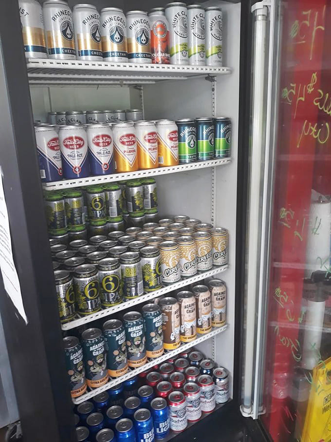 The beer fridge &ndash; a colorful aluminum garden of local and national brews, standing ready to tame the spice.