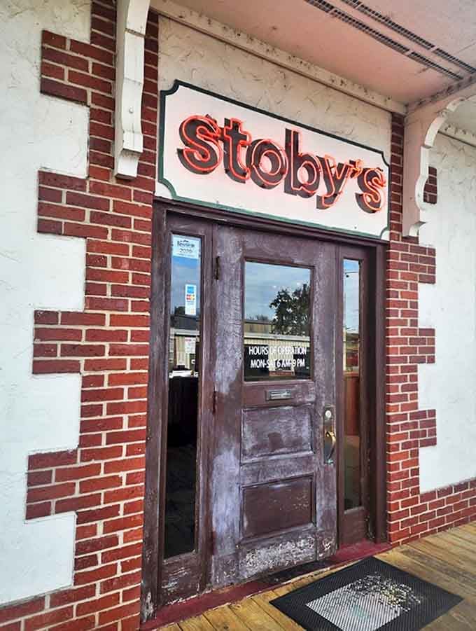 The entrance sign promises what lies beyond &ndash; unpretentious comfort food that's been drawing locals and travelers alike through this weathered wooden door for decades.