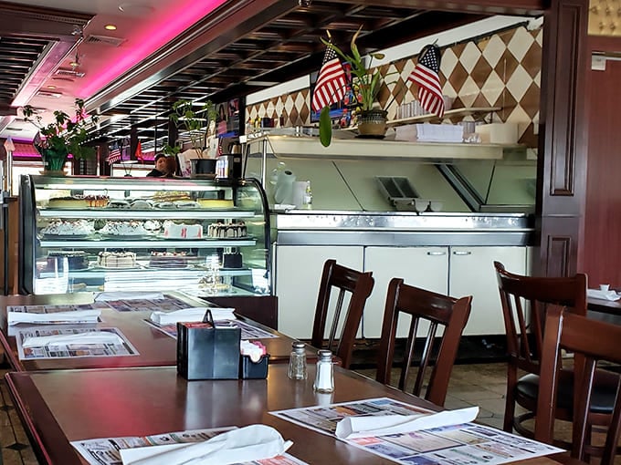 The dessert case and counter&mdash;where willpower goes to surrender. Those swivel seats have witnessed countless "I'll just have coffee... and maybe a slice of pie" moments.