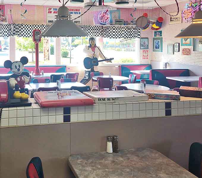 Mickey Mouse watches over diners while Elvis stands guard&mdash;icons from different eras united in their appreciation of a good American meal.