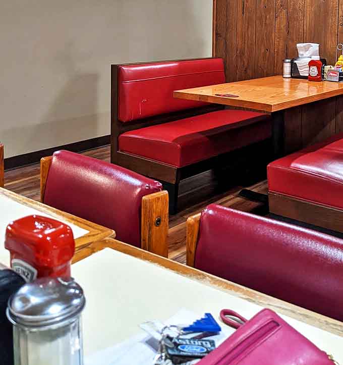 A row of booths standing at attention, each one ready to cradle you in vinyl comfort while you contemplate that second slice of pie.