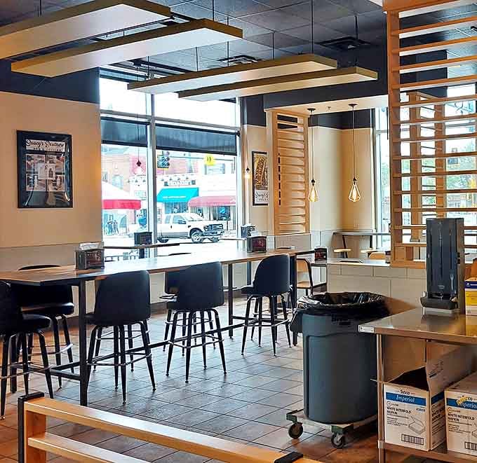 Sunshine streams through windows illuminating tables where BBQ dreams come true. Like a theater stage set for a delicious performance.