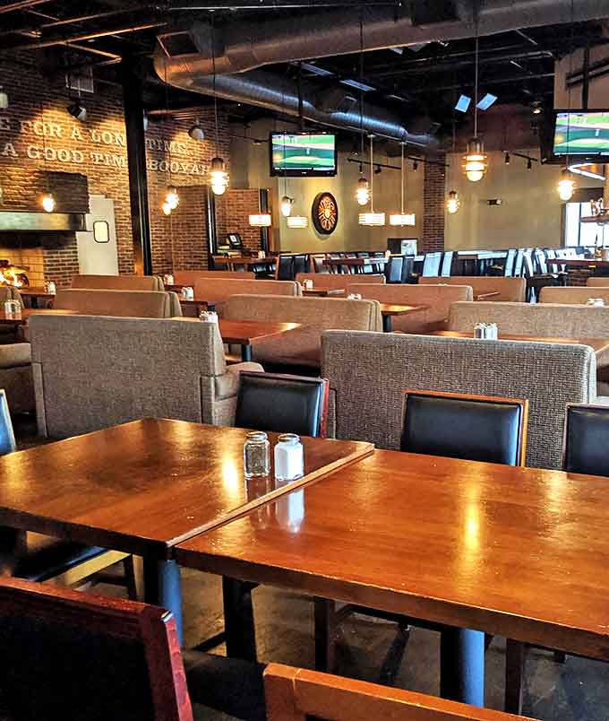 Industrial meets cozy in this dining room where exposed ductwork and pendant lighting create an atmosphere of casual sophistication.