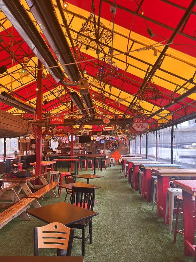 The tent-covered outdoor area glows with festive red and yellow. It's like dining inside the world's most delicious circus tent.
