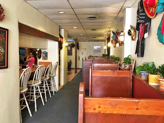 The wooden booths and counter seating aren't just furniture&mdash;they're front-row tickets to Santa Fe's most delicious show.