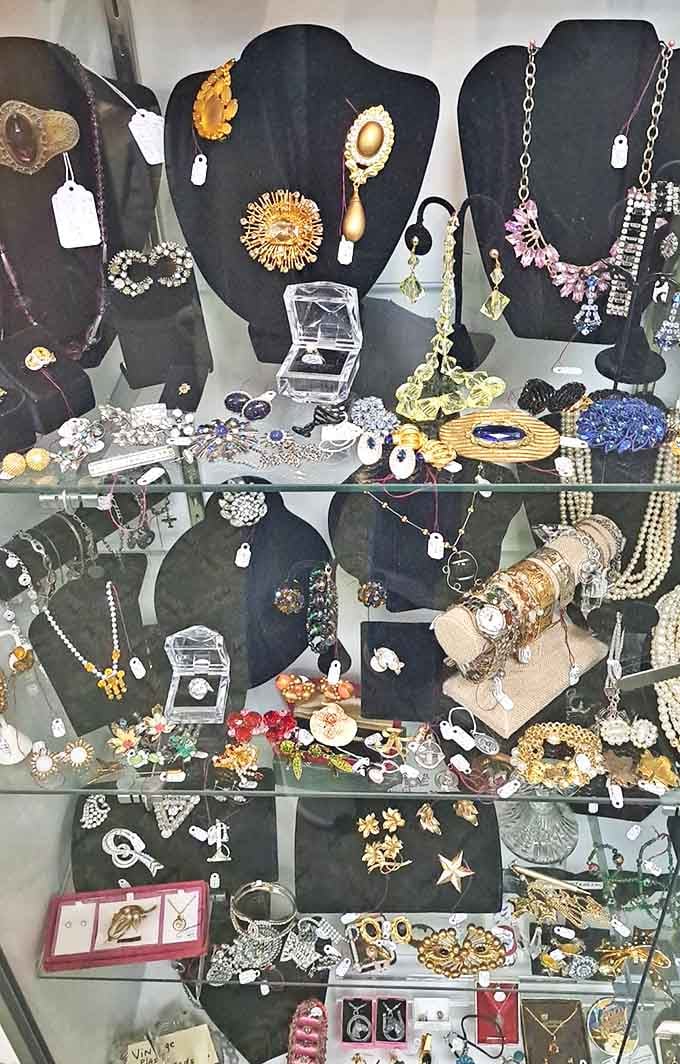 Jewelry displays that sparkle with history—from mid-century brooches to art deco necklaces, each piece once made someone feel special.