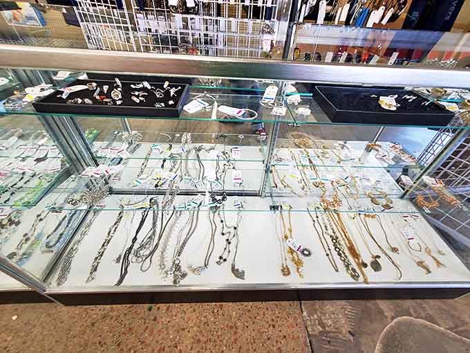 The jewelry counter sparkles with forgotten treasures. Someone's former statement piece is about to become your conversation starter.