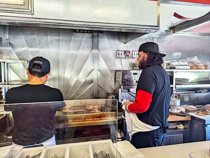 Behind the scenes where the magic happens. These cooks have flipped more eggs than most of us have had hot breakfasts.