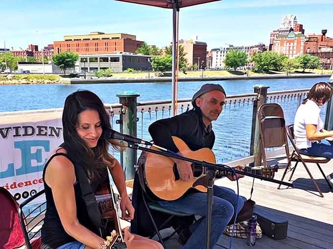 Live music transforms shopping into an experience. These riverside performances add the perfect soundtrack to your treasure hunting.