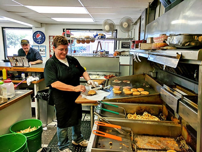 Behind the scenes where the magic happens—a grill that's seen more action than a Hollywood stuntman and knows exactly how to treat a burger right.