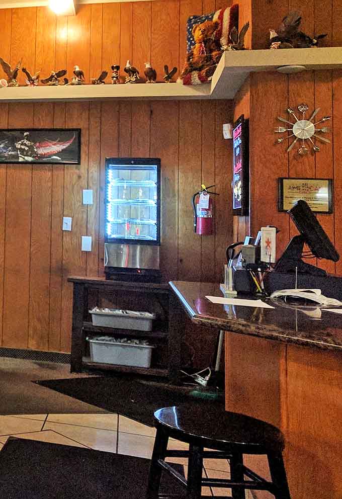 Wood-paneled nostalgia with a collection of eagles standing guard&mdash;this isn't just decoration, it's a statement about American dining pride.