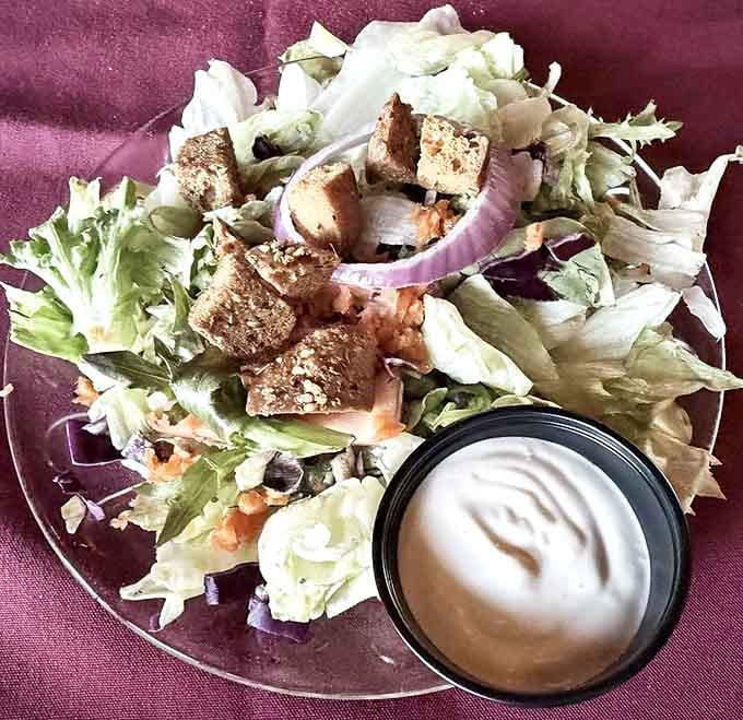 A salad that knows its role &ndash; fresh, crisp, and ready to prepare your palate for the parade of comfort food that's about to follow.