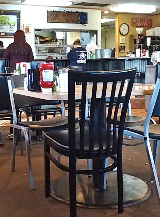 The dining room view reveals the beating heart of Sill's&mdash;where servers navigate between tables with the precision of Olympic athletes.