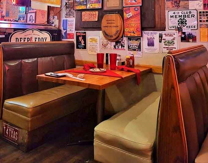 A booth that invites you to settle in and stay awhile. The walls plastered with memorabilia create a time capsule of Americana and good eating.