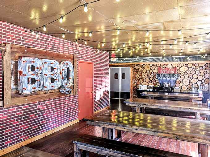 String lights overhead turn simple wooden tables into something special. Rustic charm that doesn't try too hard.