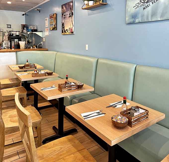 Mint-green booths and wooden tables create that perfect "neighborhood gem" atmosphere where memories are made between bites.