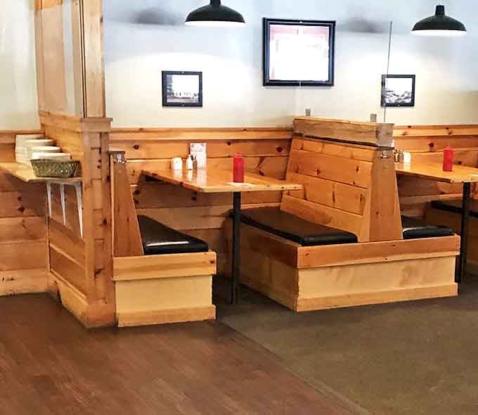 These wooden booths aren't just seating&mdash;they're private dining sanctuaries where seafood dreams come true one bite at a time.