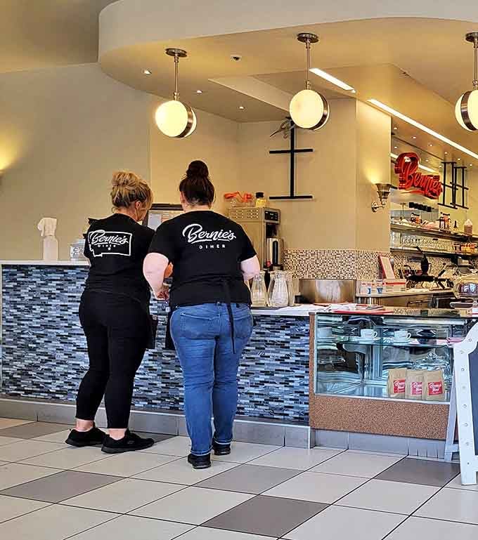 Bernie's staff in their signature black tees—the unsung heroes behind every perfect breakfast and lunch that emerges from this kitchen.