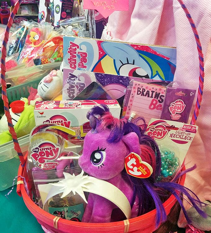 My Little Pony paradise! Childhood nostalgia packaged neatly in pink baskets, proving that yesterday's toys become tomorrow's collectibles faster than we realize.
