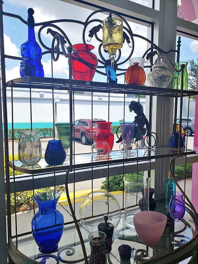 Sunlight dances through colorful glass vases, creating a stained-glass effect that transforms ordinary windowsills into extraordinary art displays.