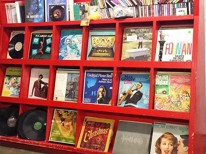 Vinyl records displayed like art in their vibrant red showcase&mdash;a time machine for music lovers who remember when album covers were meant to be admired.