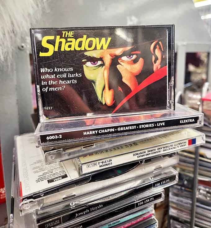 Audio time capsules stacked with nostalgic precision. That cassette of "The Shadow" might be the perfect soundtrack for your next road trip down memory lane.
