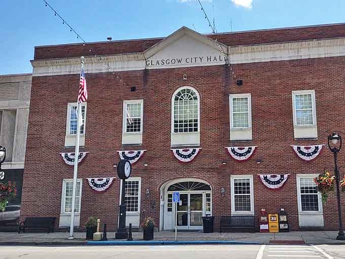 Glasgow City Hall stands decorated in patriotic bunting, embodying the civic pride that forms the backbone of this postcard-perfect community.