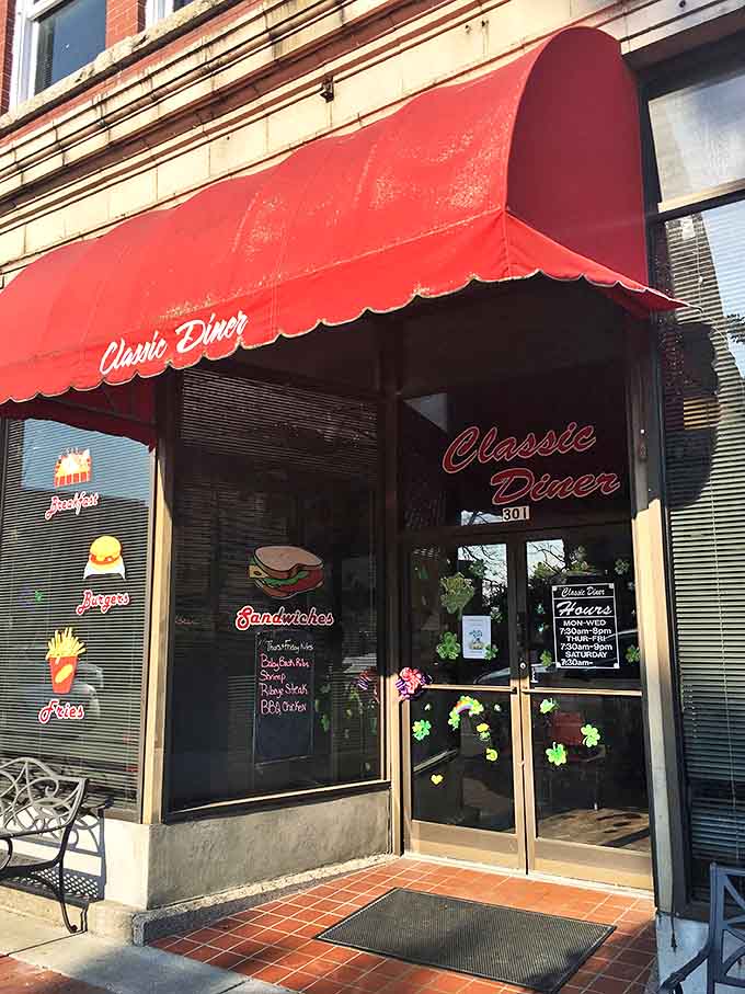 The Classic Diner's red awning promises comfort food without pretension. That neon sandwich sign speaks directly to my soul.