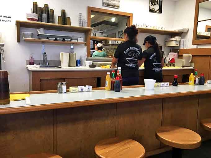 The counter where countless orders have been placed and friendships formed. Wood-worn and wonderful&mdash;just like the best stories.