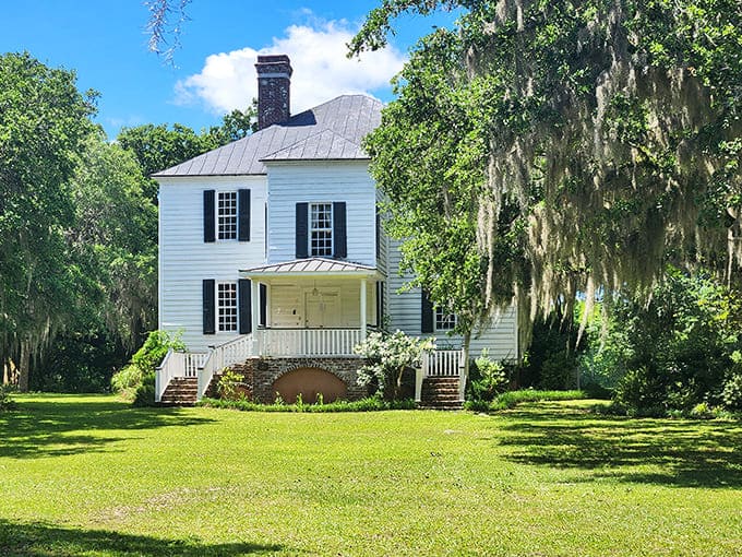 Hopsewee Plantation's pristine white clapboard and symmetrical charm belie the complex history written into every board and brick of this coastal estate.