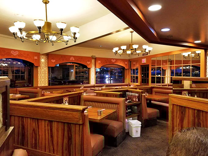 The evening lighting transforms Anna Miller's into a cozy haven where booths become private dining rooms for sharing stories and desserts.