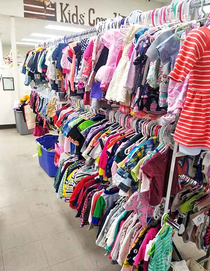 The kids' section: where growing pains meet budget-friendly solutions. These rainbow racks of tiny fashions make parenting slightly less expensive and significantly more colorful.