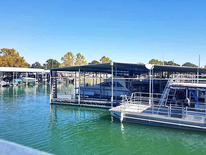 Marina life: where boats take naps under metal canopies and dream of tomorrow's adventures on that impossibly blue water.