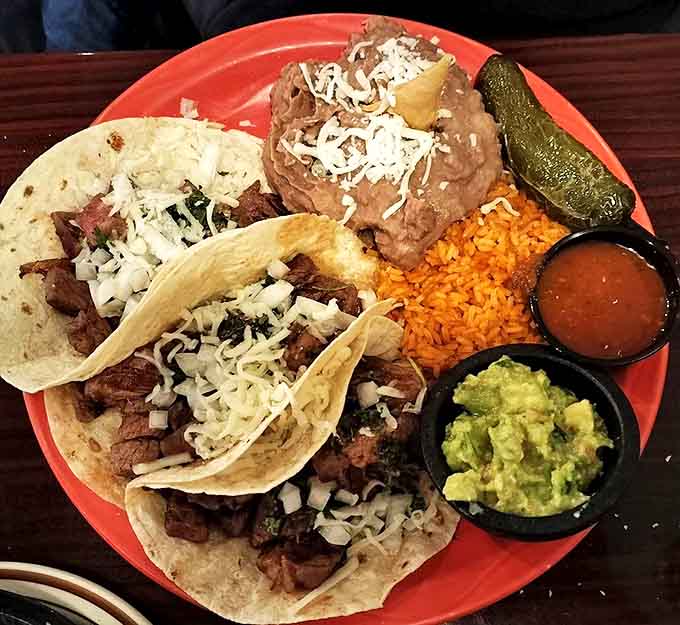 Street tacos that don't need a passport to deliver authentic flavor. The rice and beans are not mere supporting actors but co-stars.