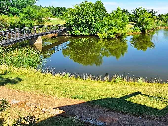 A picturesque bridge spans calm waters at Northeast Lions Park, creating postcard-worthy moments. Nature and infrastructure in perfect harmony.